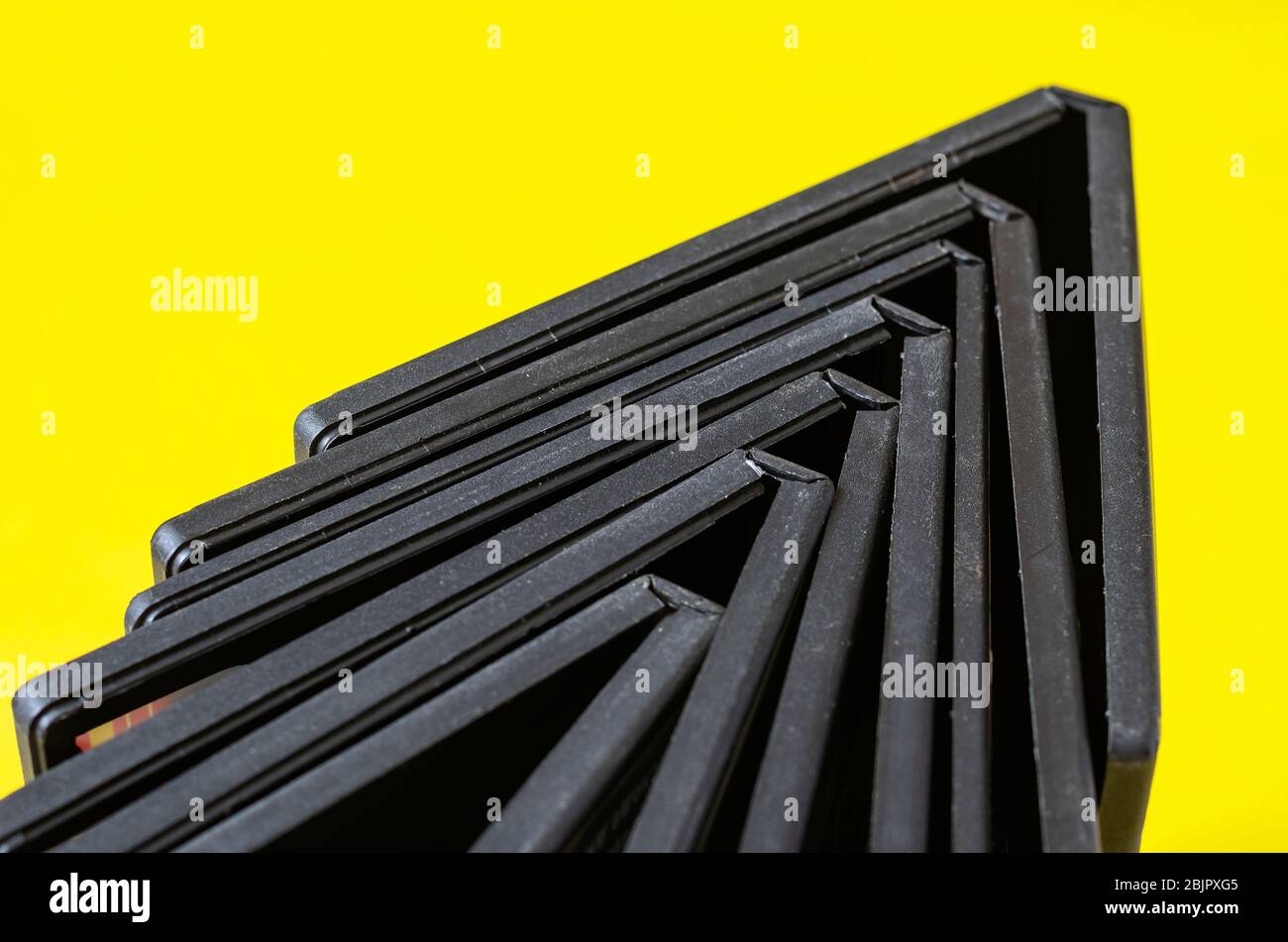 Black disk boxes in the shape of an arrow on a yellow background. Set ...