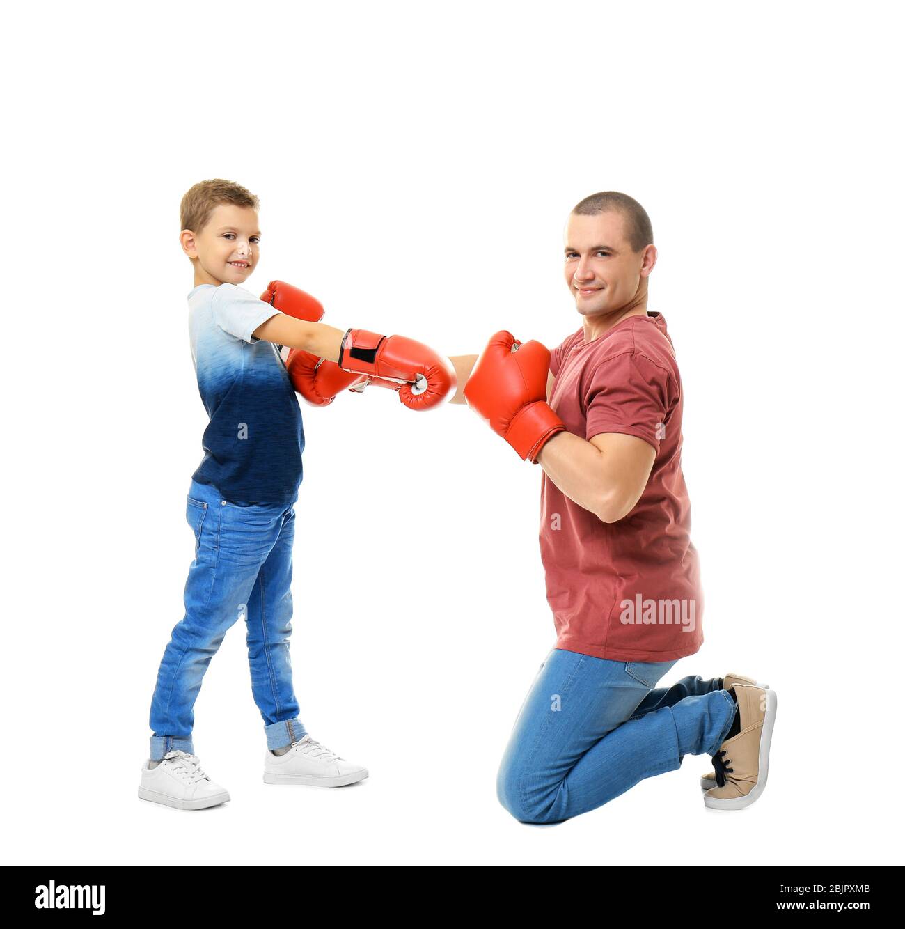 Dad and his son in boxing gloves on white background Stock Photo - Alamy