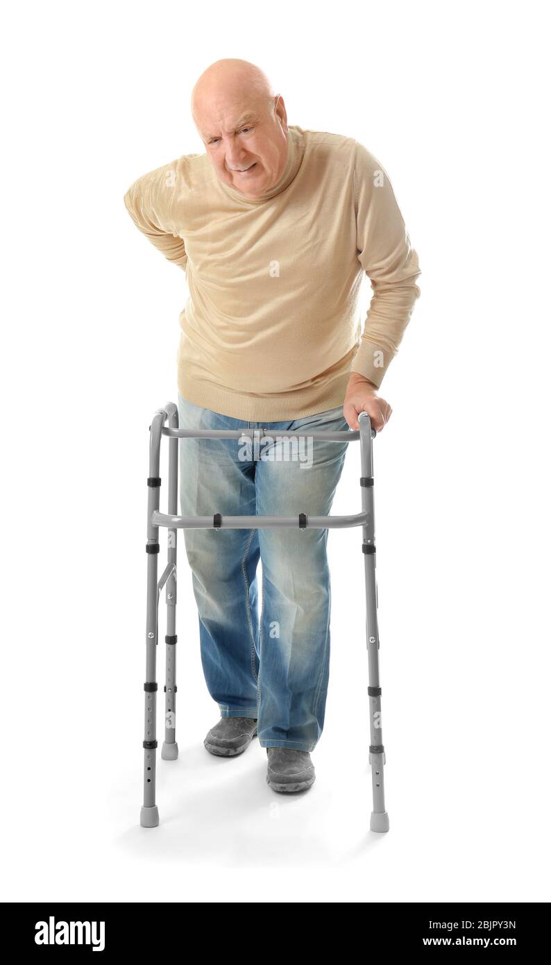 Elderly man with walking frame on white background Stock Photo - Alamy