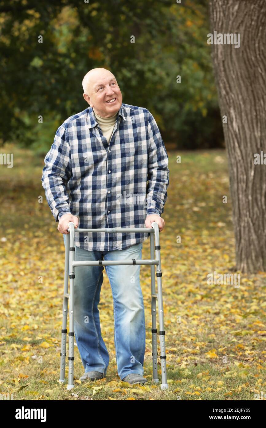 Elderly man walking frame hi-res stock photography and images - Alamy
