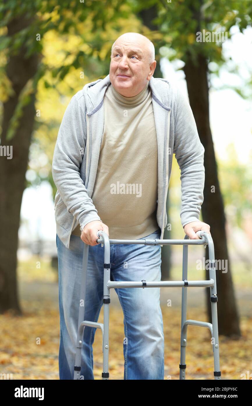 Elderly man walking frame hi-res stock photography and images - Alamy