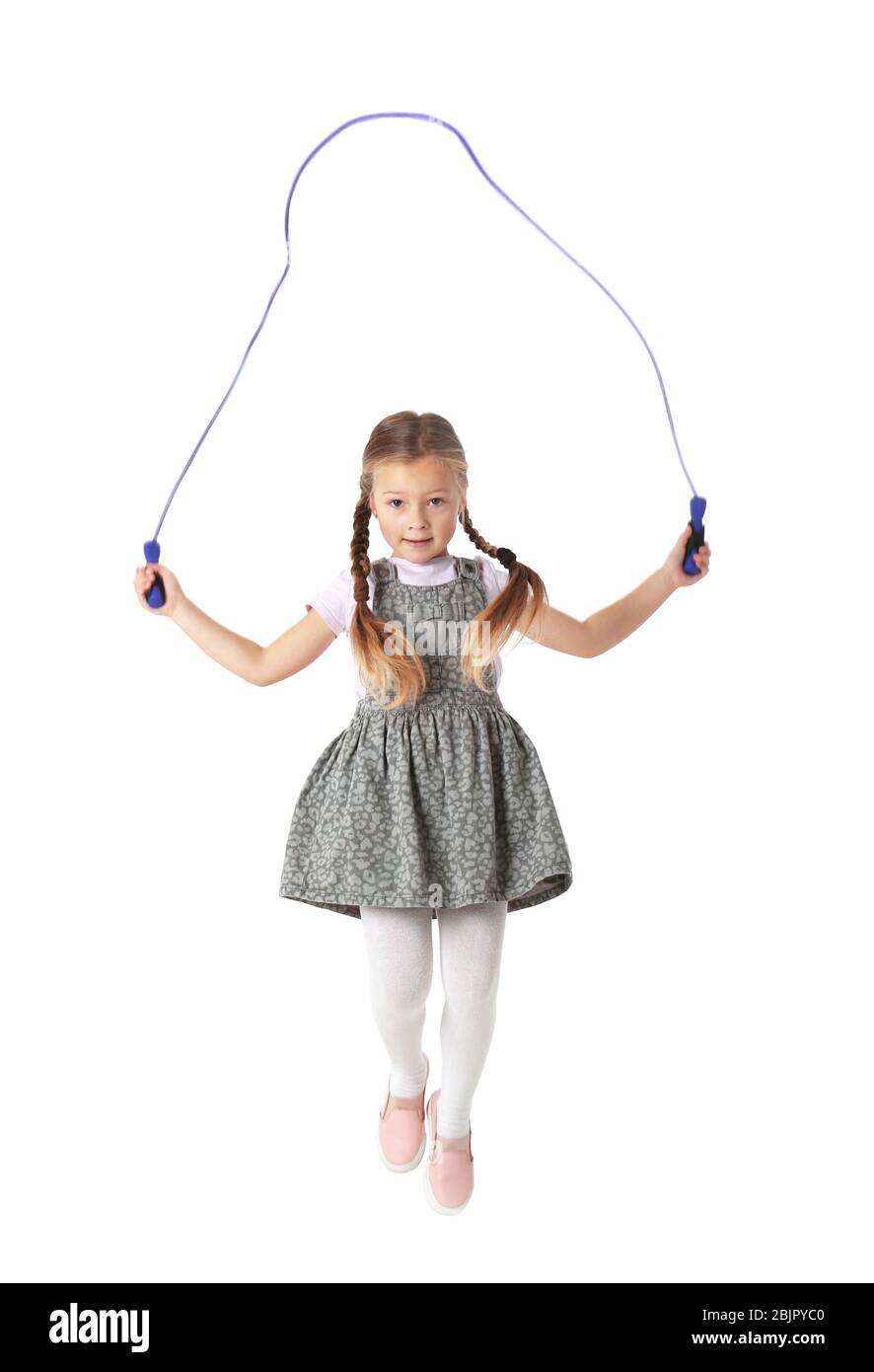 Cute little girl playing with jumping rope on white background Stock ...