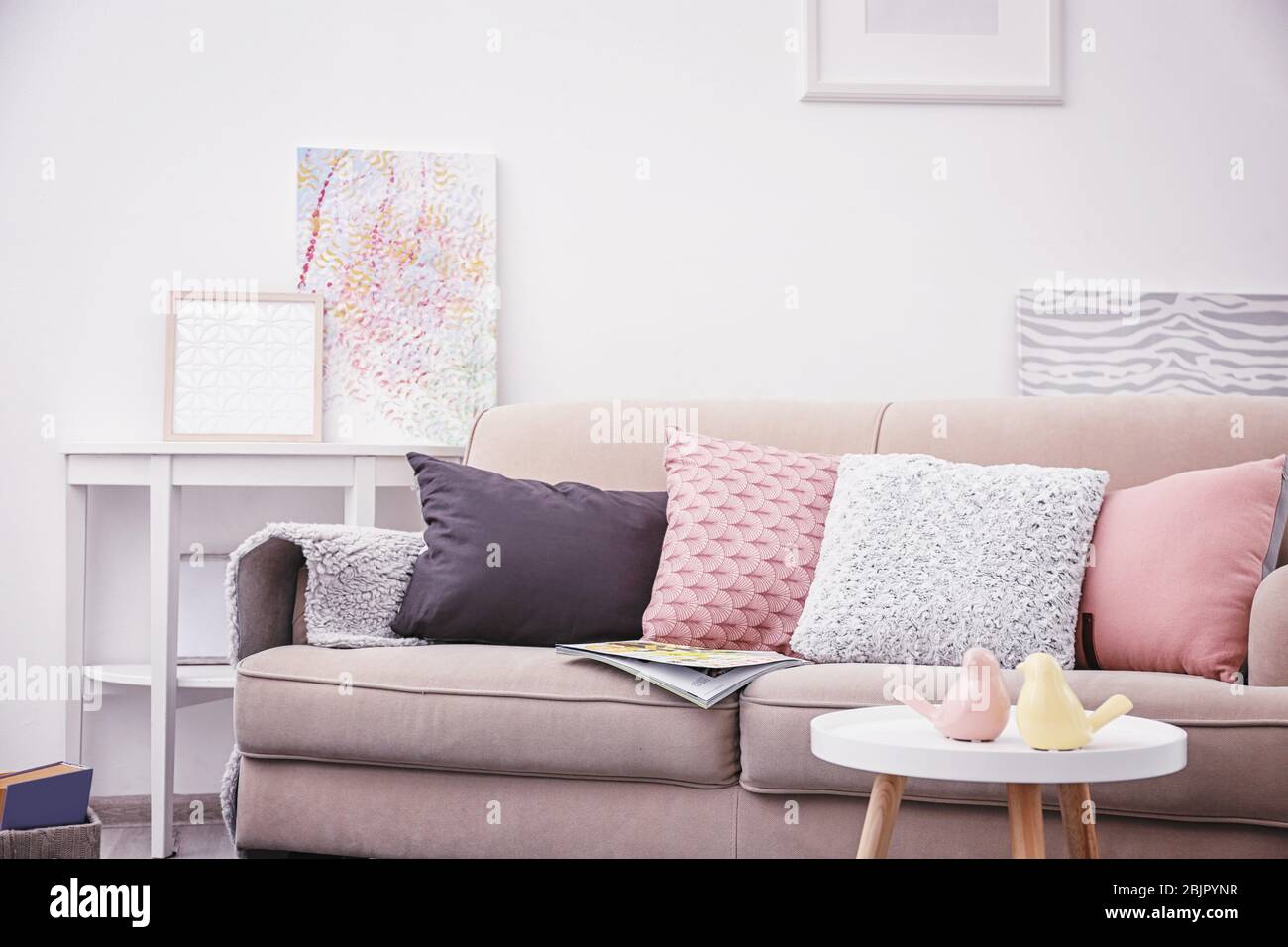 Modern living room interior with cozy sofa Stock Photo - Alamy