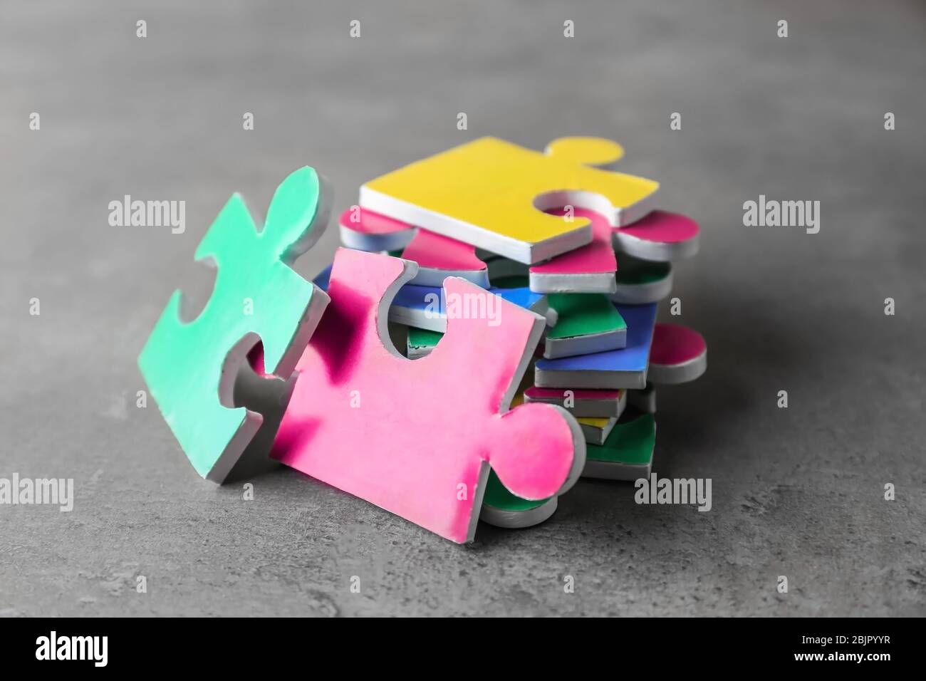 Stacked puzzle pieces hi-res stock photography and images - Alamy