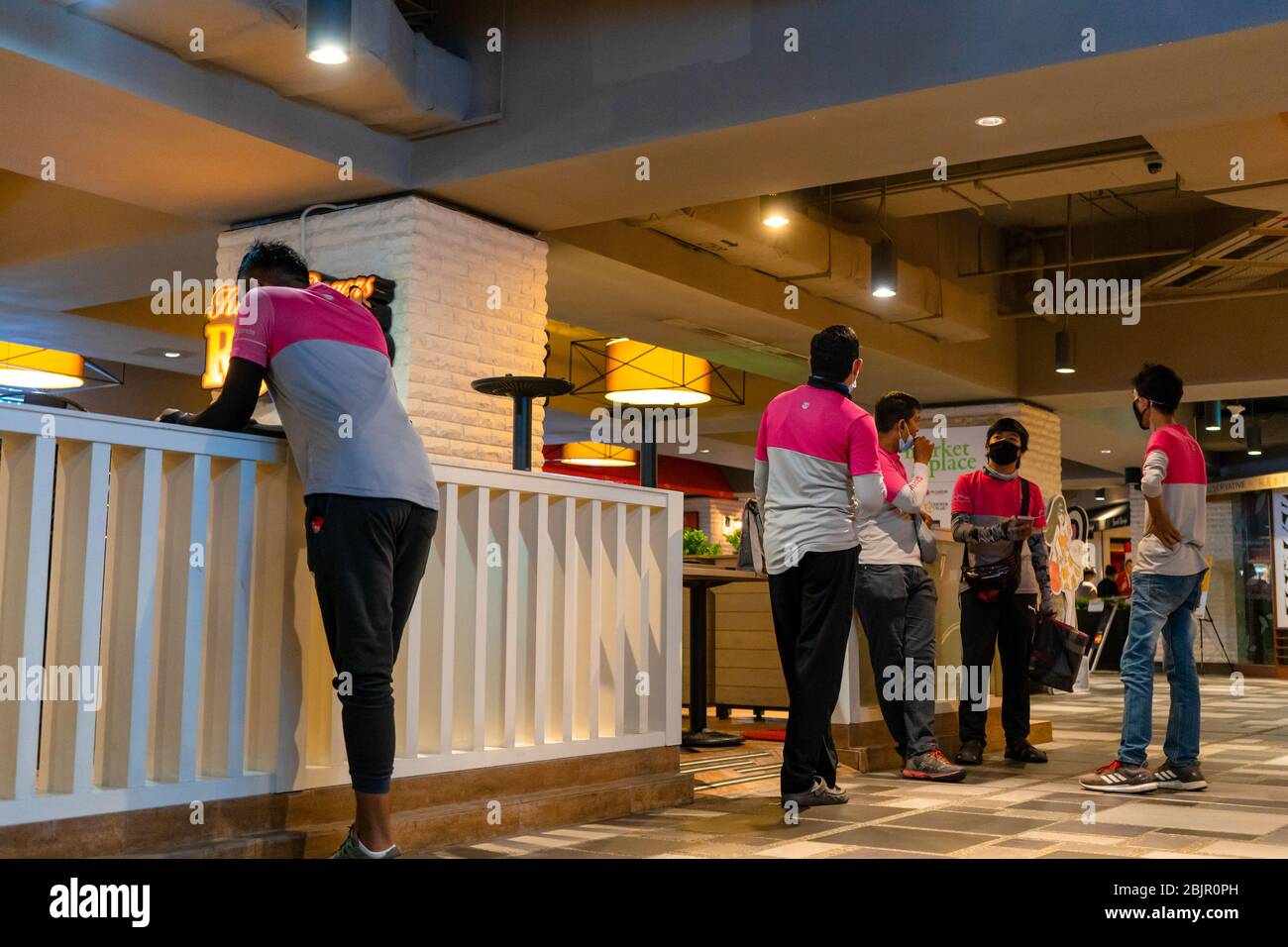 Food delivery men are waiting for a packages near the restaurant. Home ...