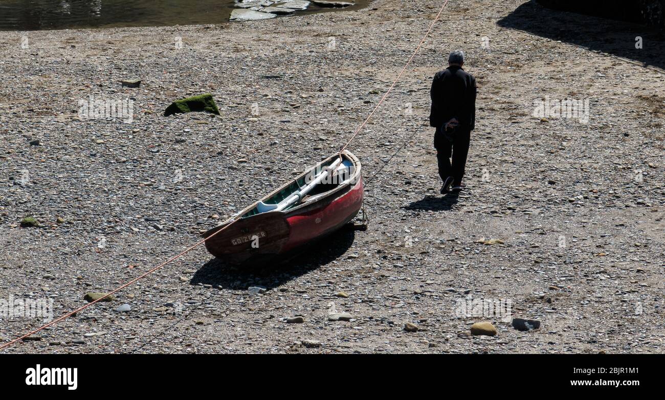 man walking in a port Stock Photo - Alamy