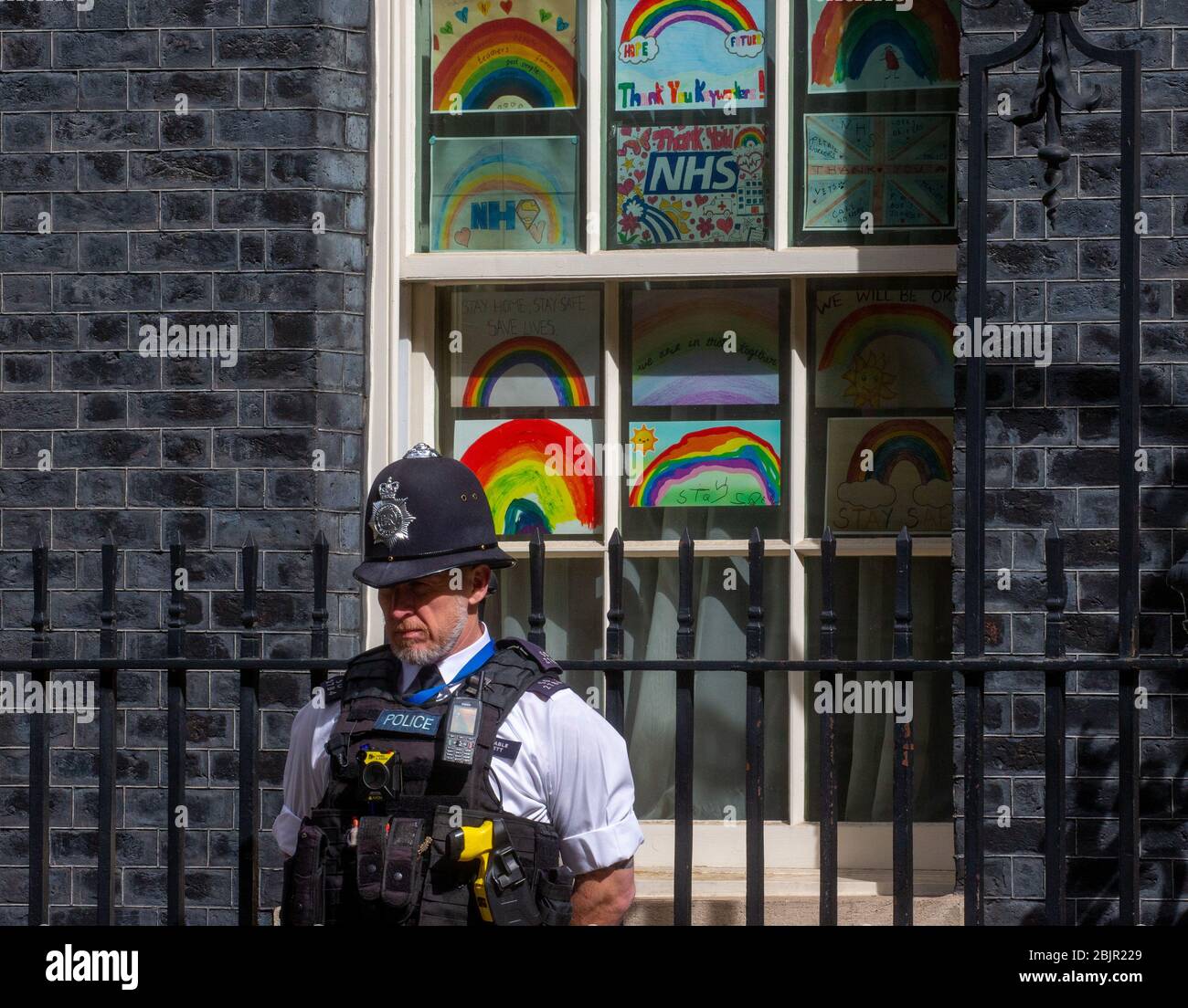 London, UK. 30th Apr, 2020. A Policeman in Downing Street in front of a ...