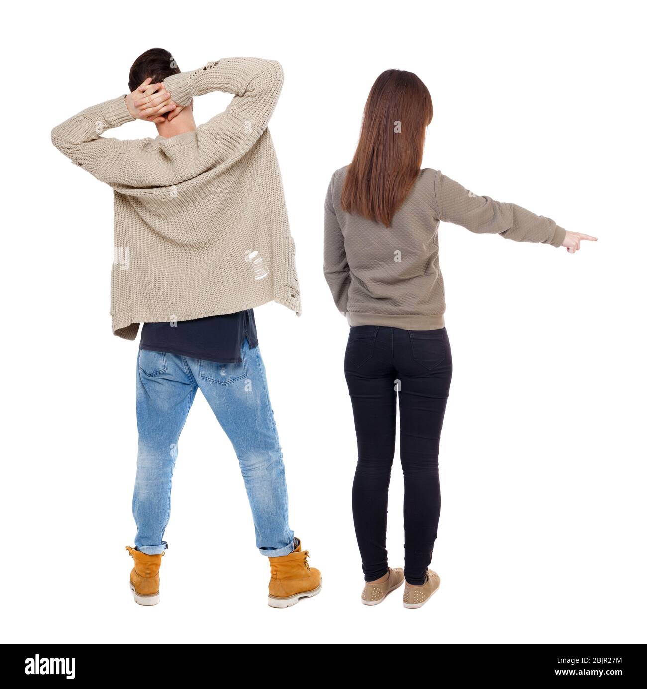 Back view of couple in sweater pointing. Rear view people collection ...