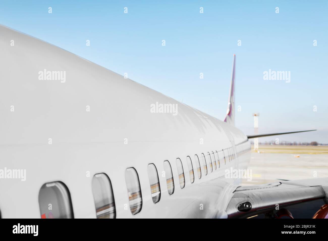 Aircraft porthole - side window airplain. White heavy passenger jet ...
