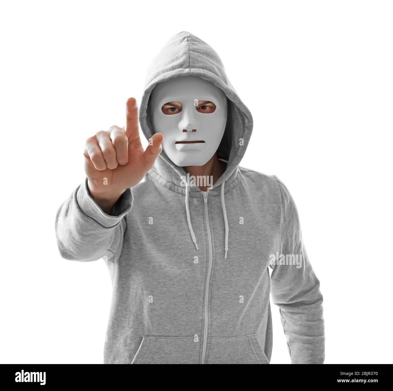 Hacker pushing button on virtual screen against white background Stock ...