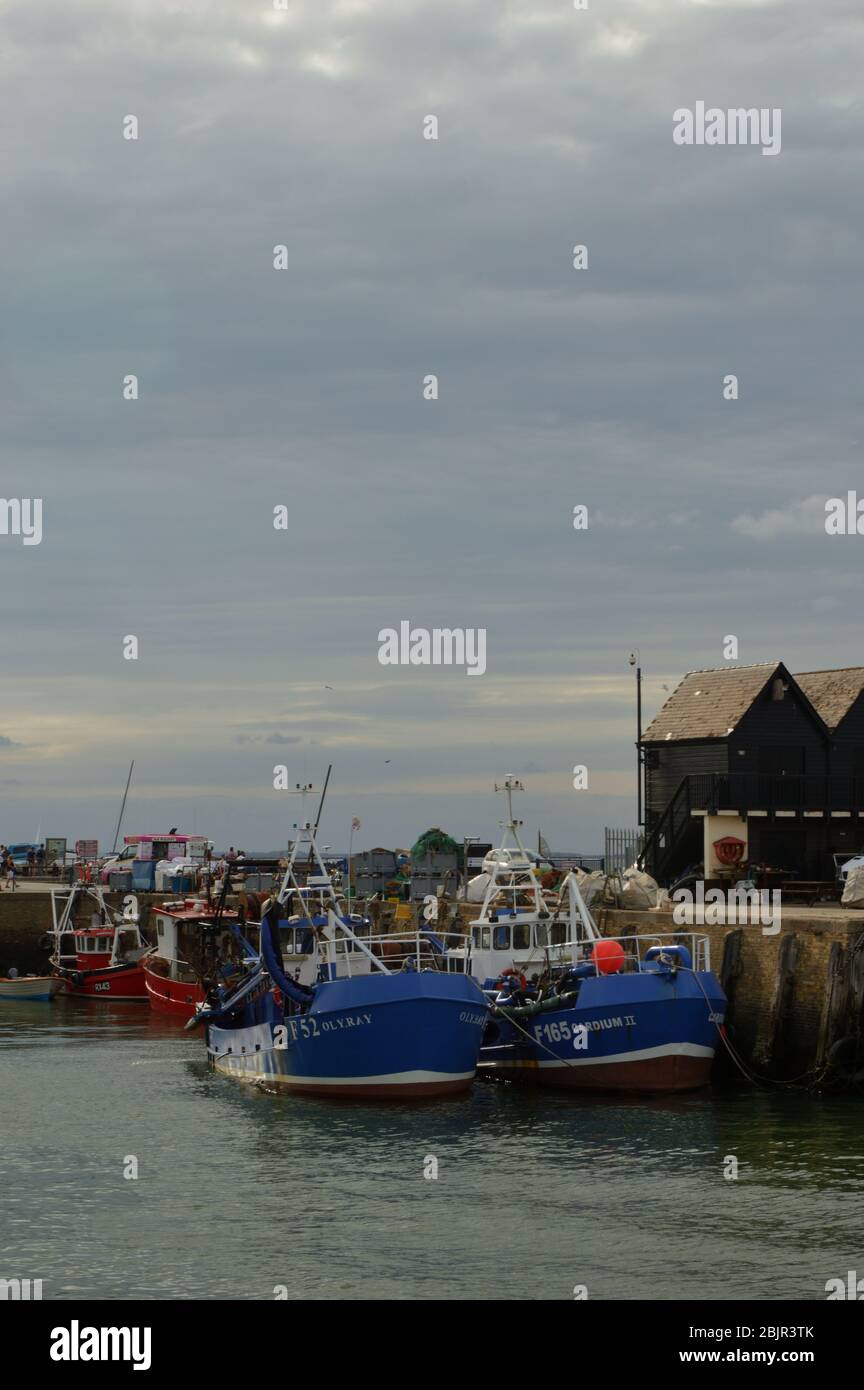 Boats in whitstable harbour Stock Photo - Alamy