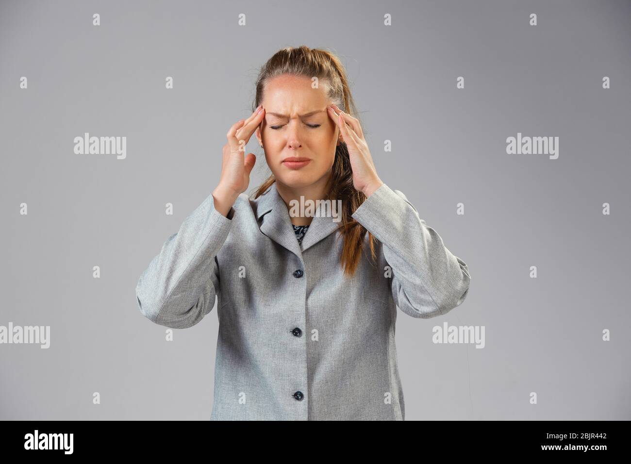 Female doctor feels headache fatigue hi-res stock photography and ...