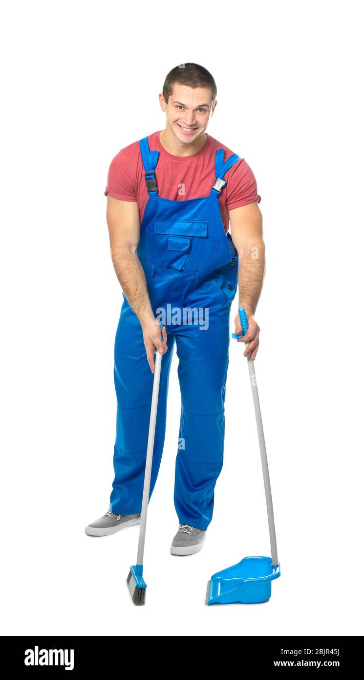 Young man with broom and dustpan on white background Stock Photo - Alamy