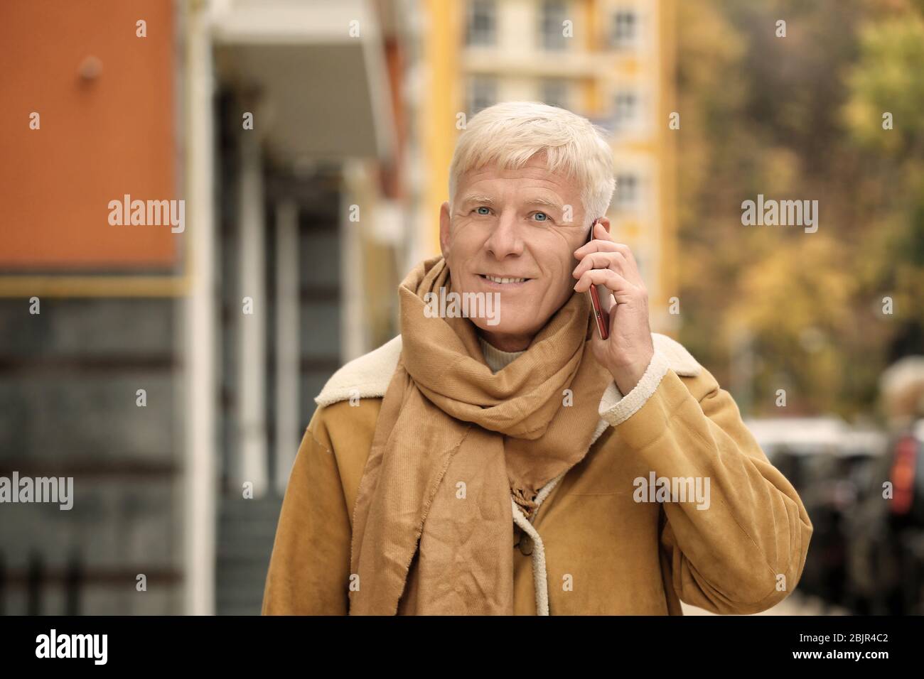 Handsome mature man talking hi-res stock photography and images - Alamy