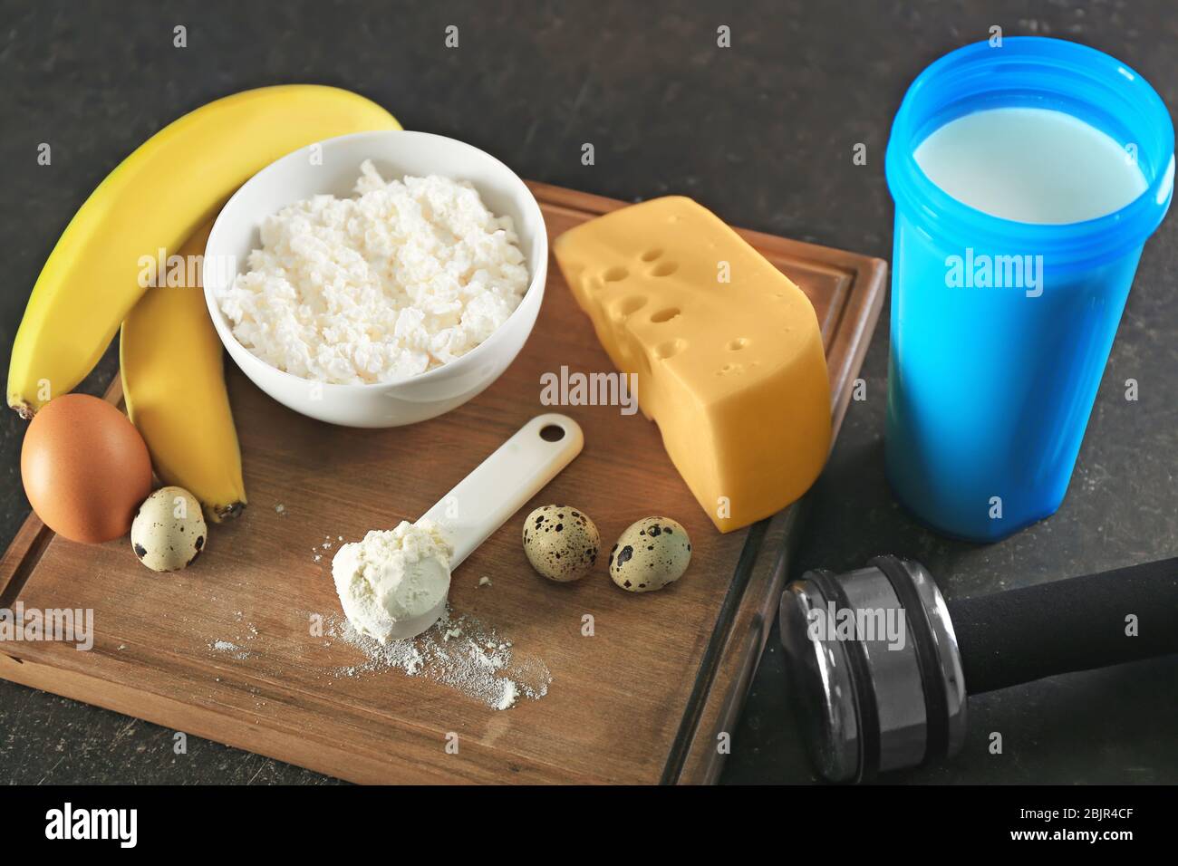 High protein food and powder on wooden board Stock Photo - Alamy