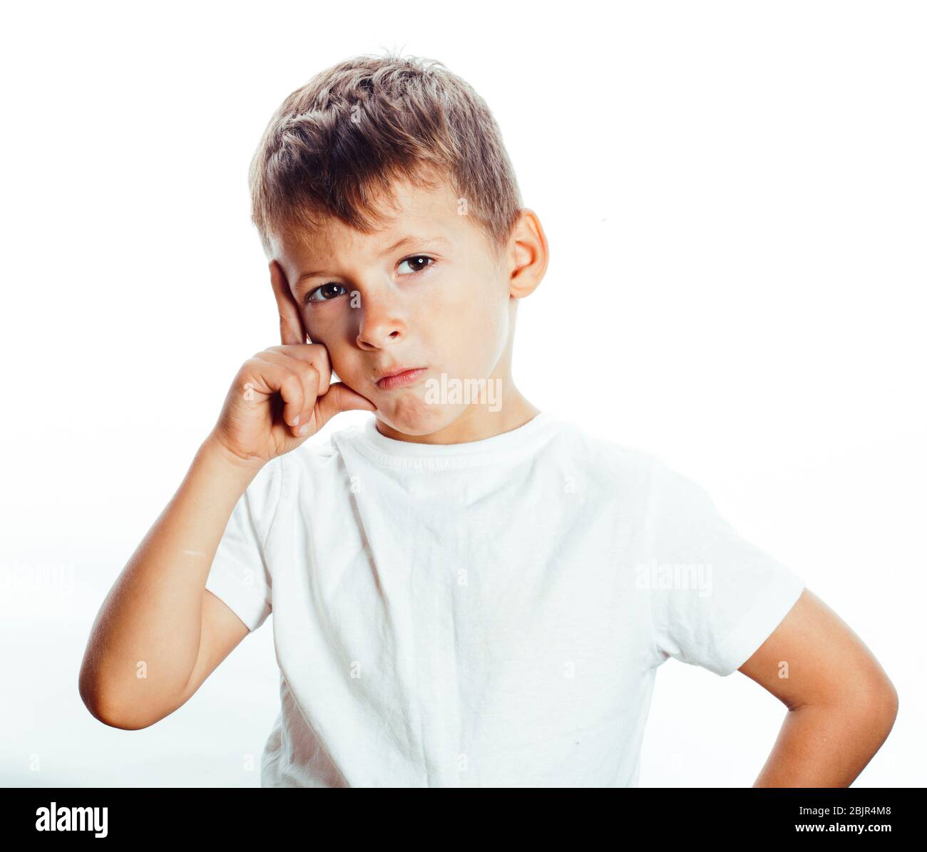young pretty little boy wondering face gesturing, pointing isolated on ...