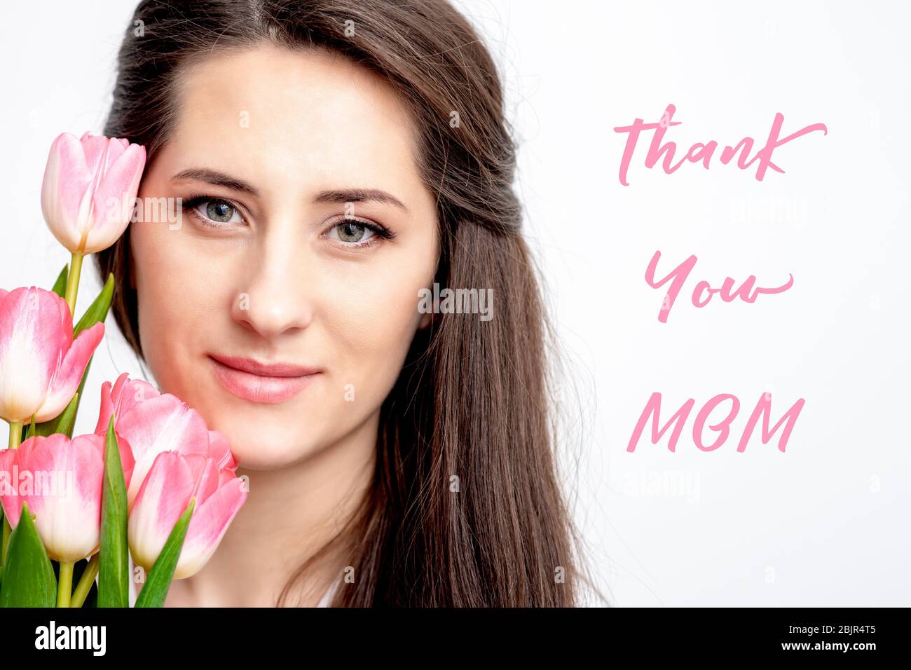 Beautiful young woman with pink tulips on white background with text ...