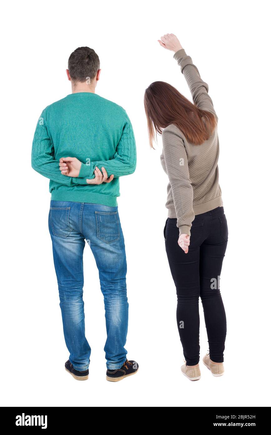 Back view of couple in sweater pointing. Rear view people collection ...