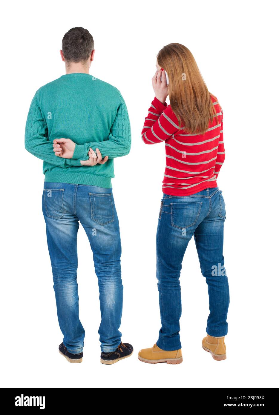 Back view of couple in sweater with mobile phone. beautiful friendly ...