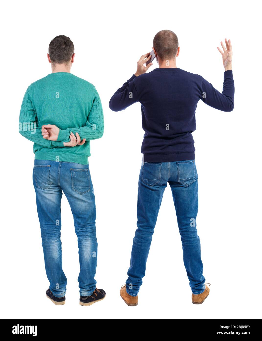 Back view of two man in sweater with mobile phone. Rear view people ...