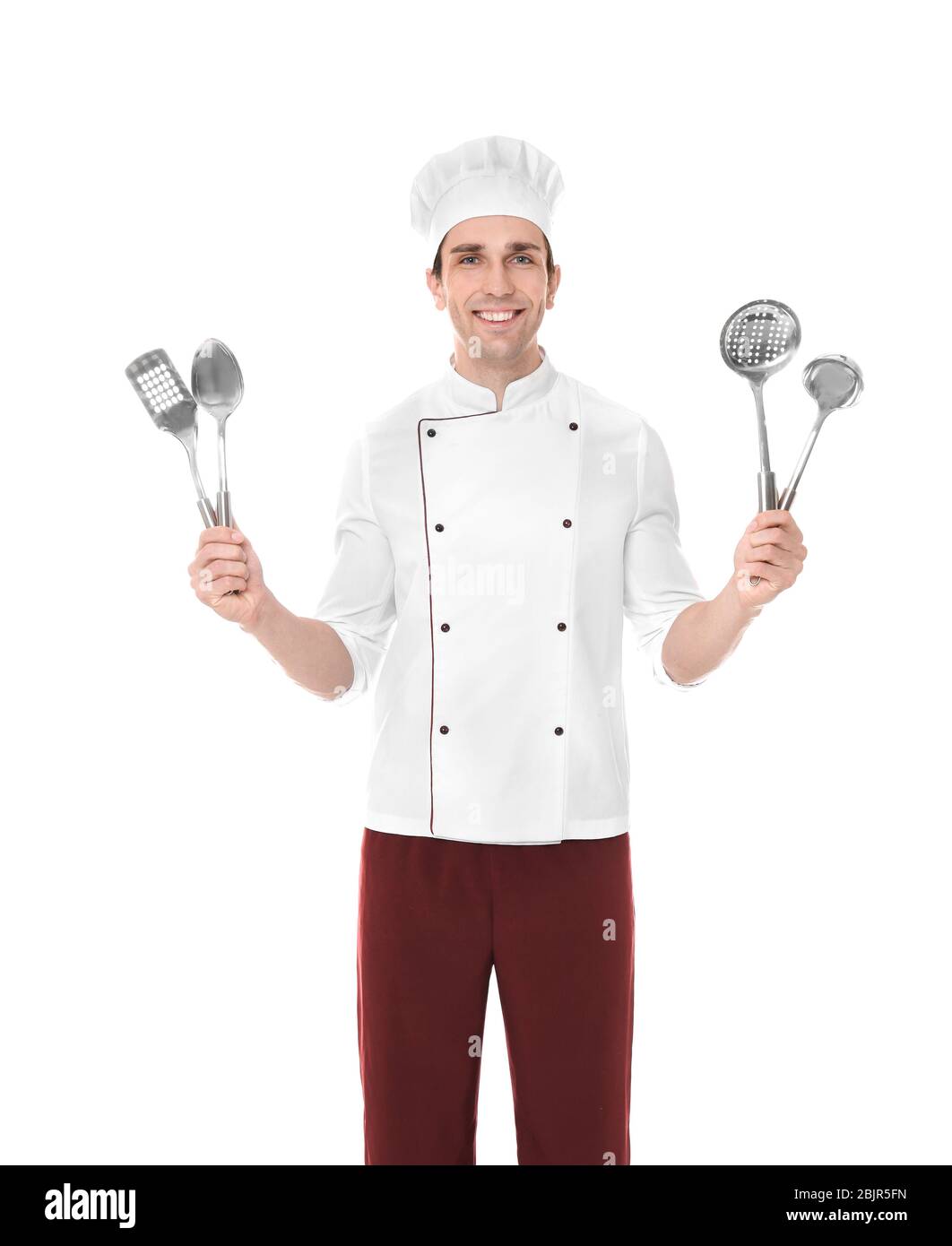 Young male chef with cooking utensils, isolated on white Stock Photo ...