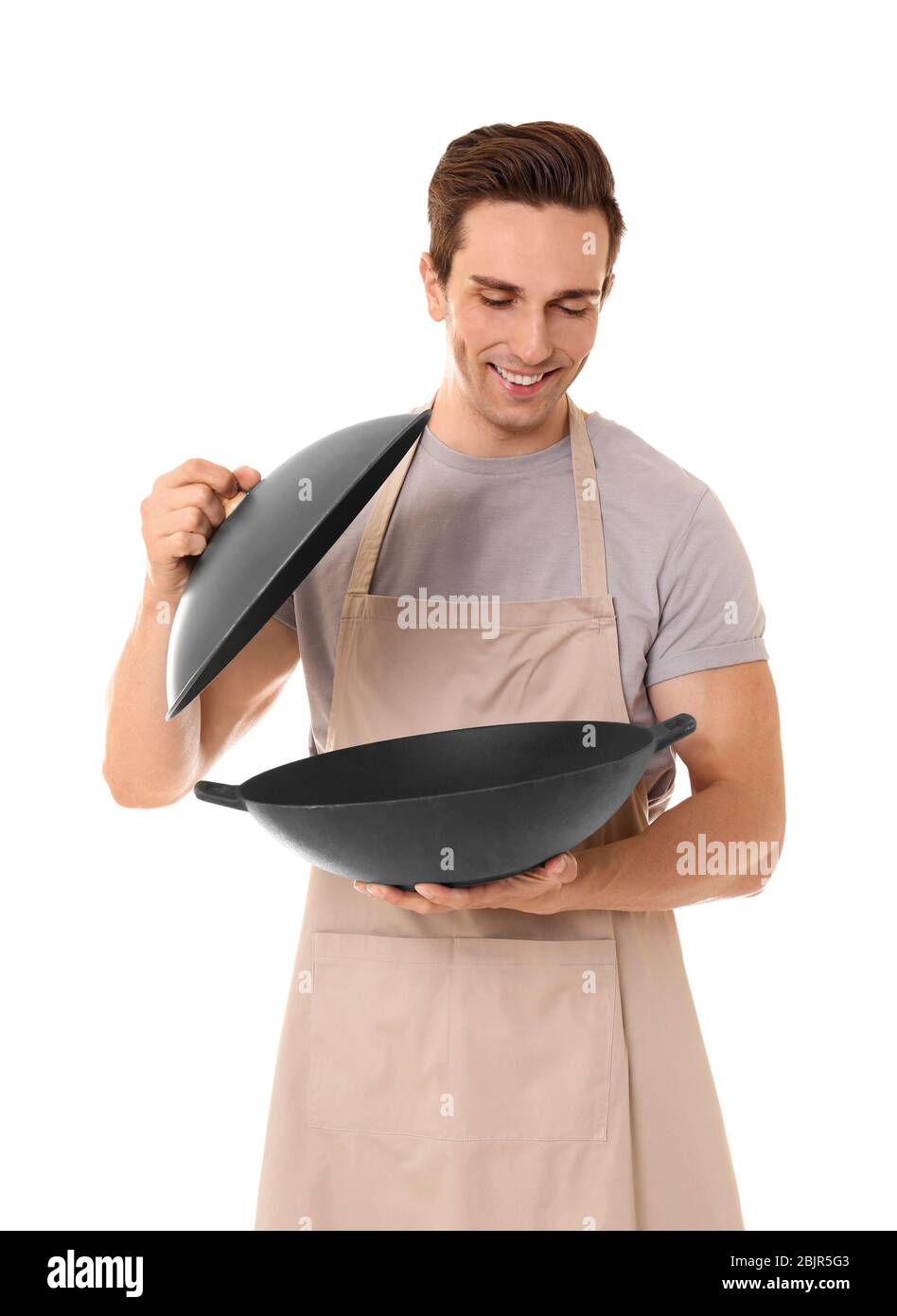 Young man with frying pan, isolated on white Stock Photo - Alamy