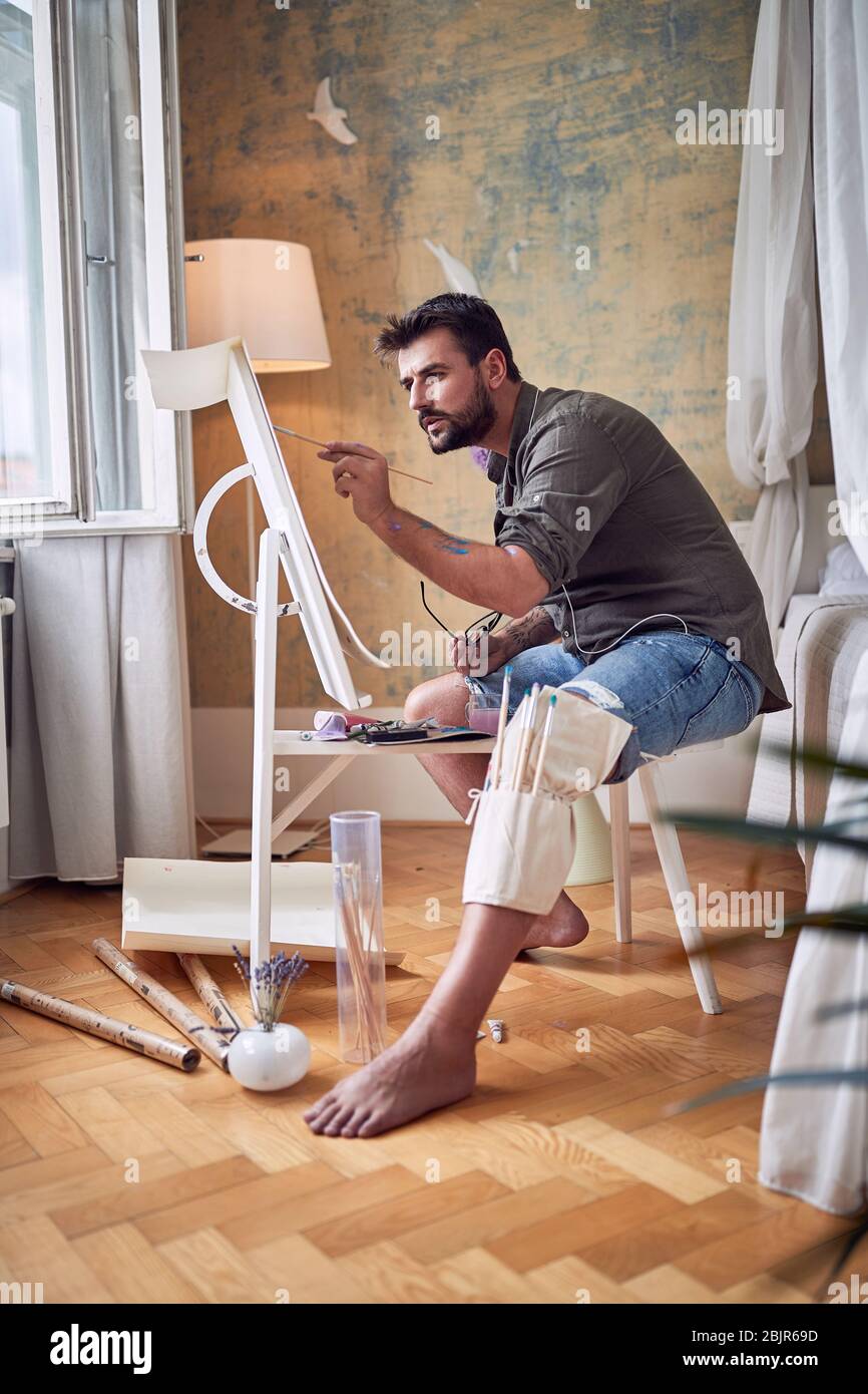 Artist working on painting hi-res stock photography and images - Alamy