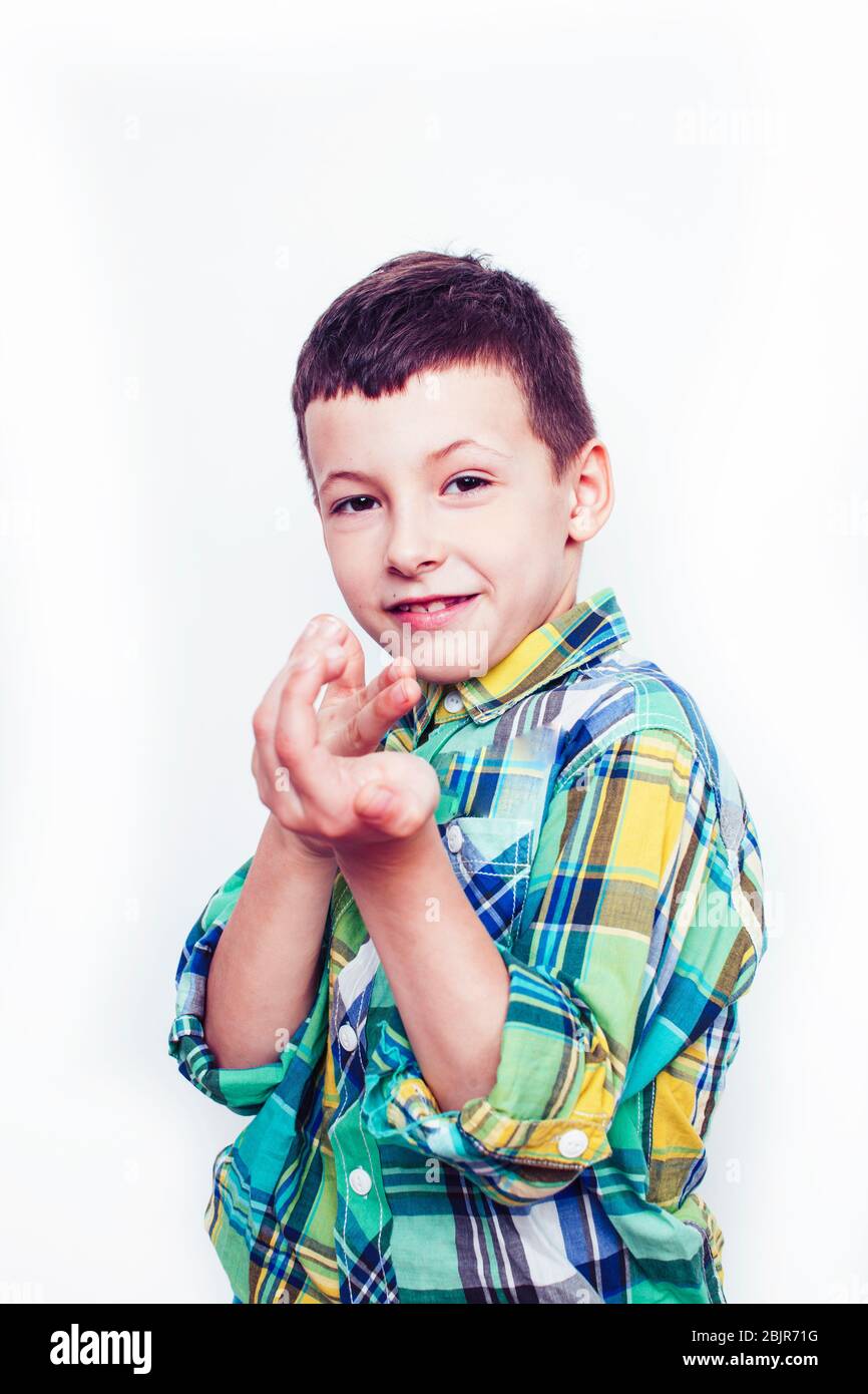 little cute real boy on white background gesture smiling close up ...