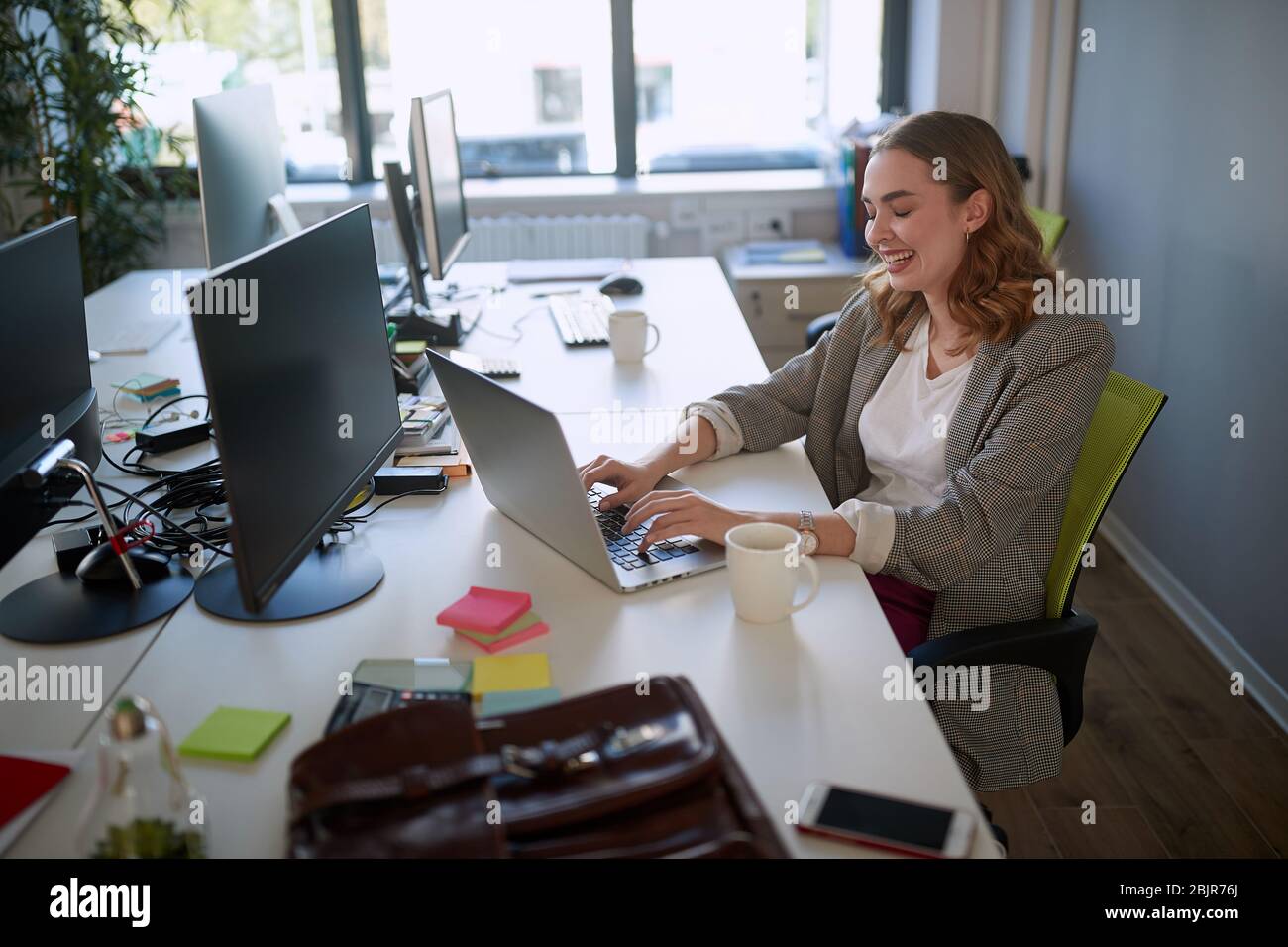 Fun atmosphere at the office is desirable, businesswoman concept Stock ...