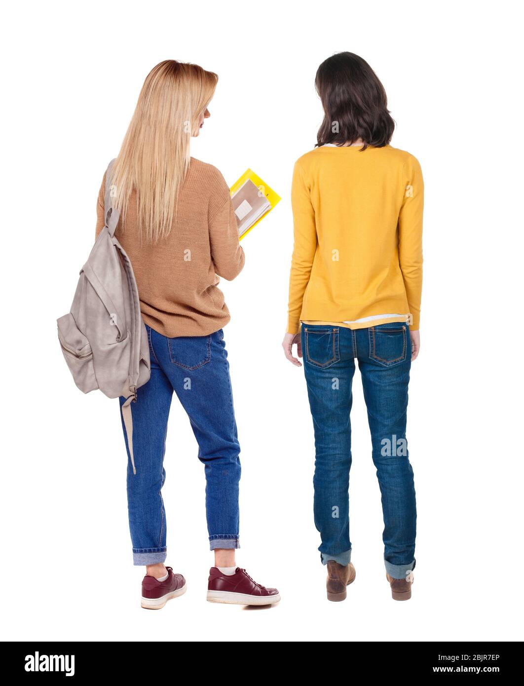 Back view of two woman in sweater. Rear view people collection ...