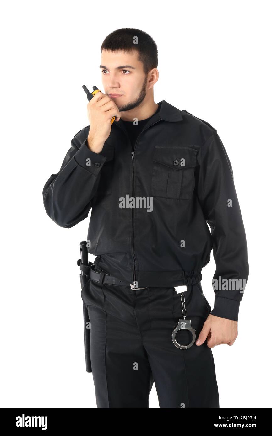 Male security guard using portable radio transmitter on white ...