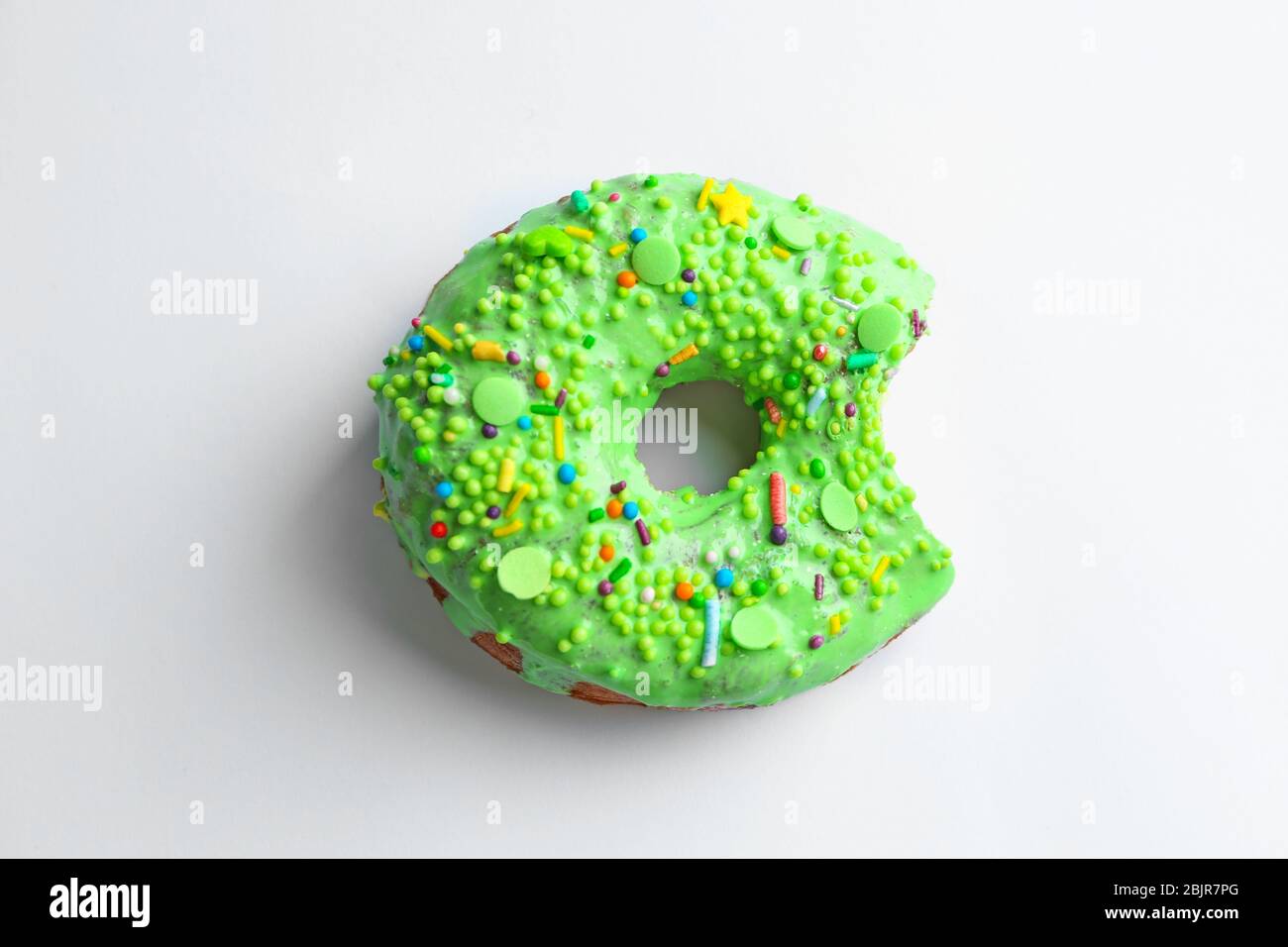 Delicious green donut on white background, top view Stock Photo - Alamy