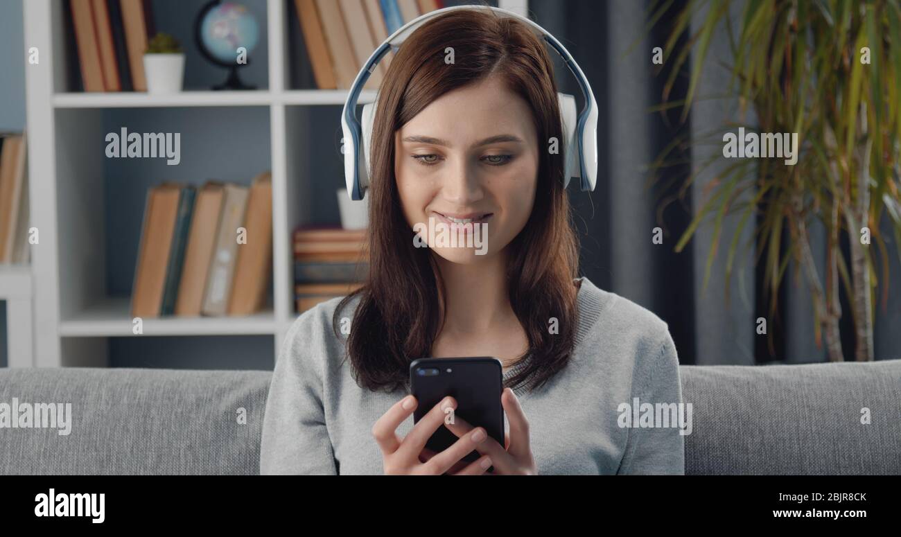 Young female using gadgets Stock Photo - Alamy