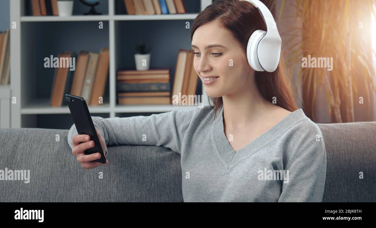 Young woman using gadgets Stock Photo - Alamy