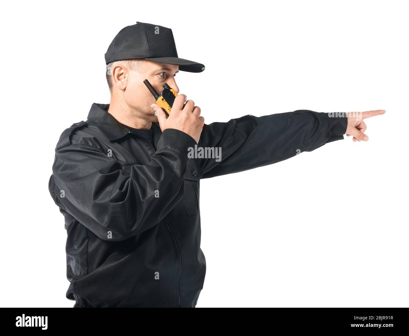 Male security guard using portable radio on white background Stock ...