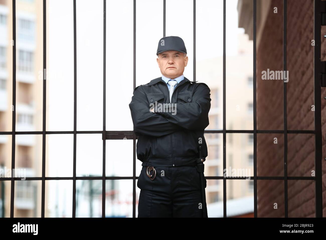 Male security guard standing hi-res stock photography and images - Alamy