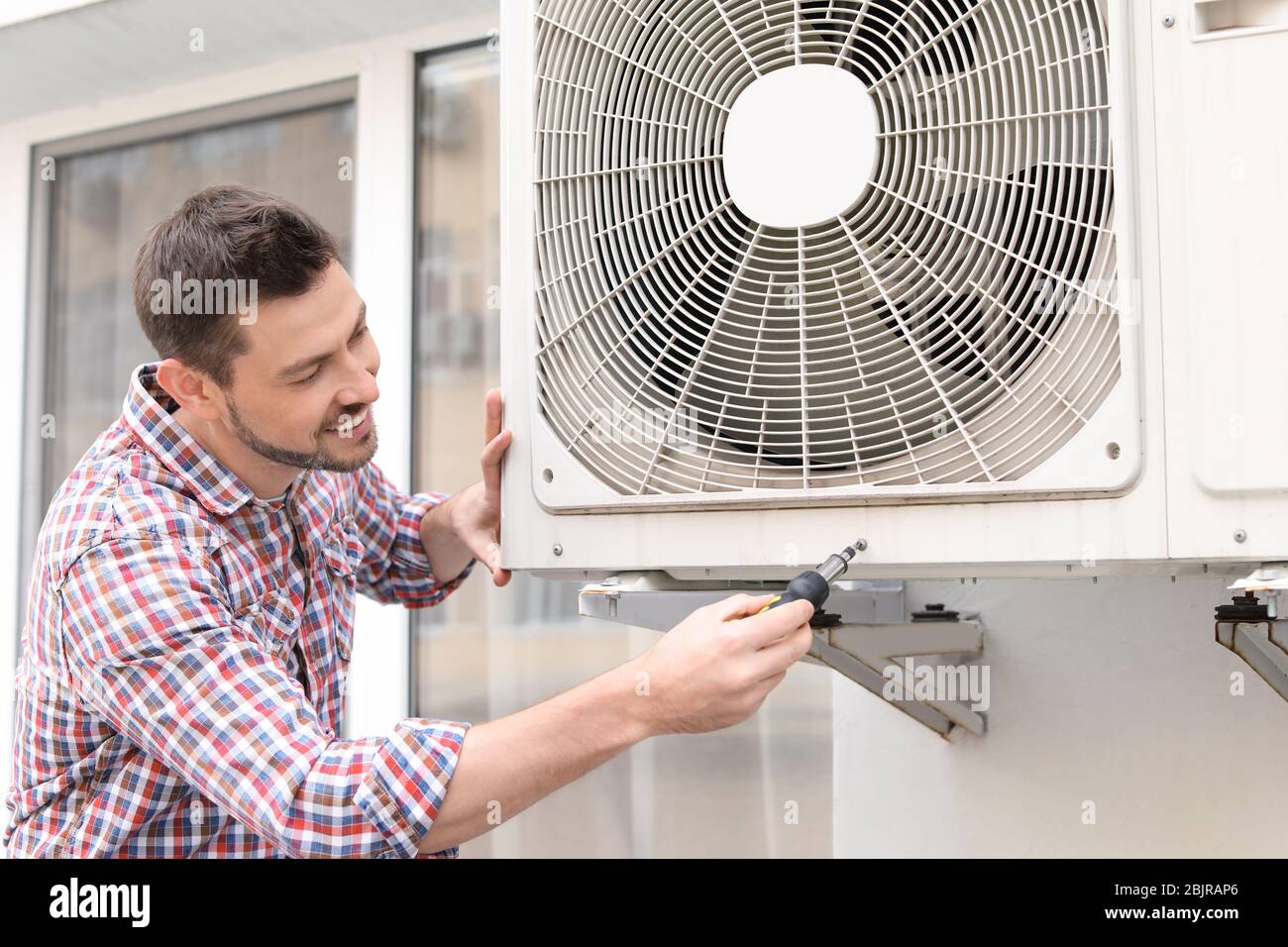 Man repairing ventilation system hi-res stock photography and images ...