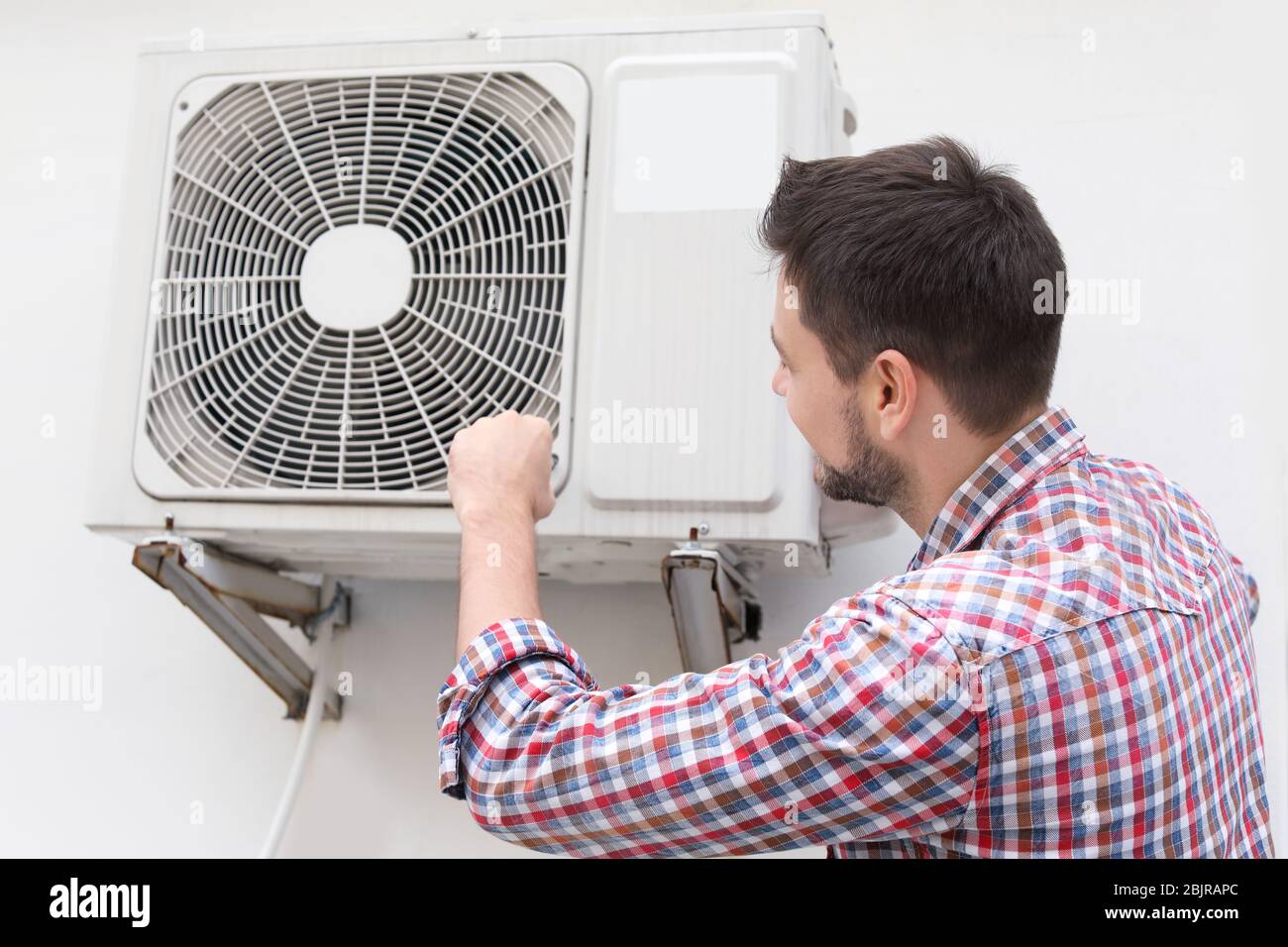 Man repairing ventilation system hi-res stock photography and images ...