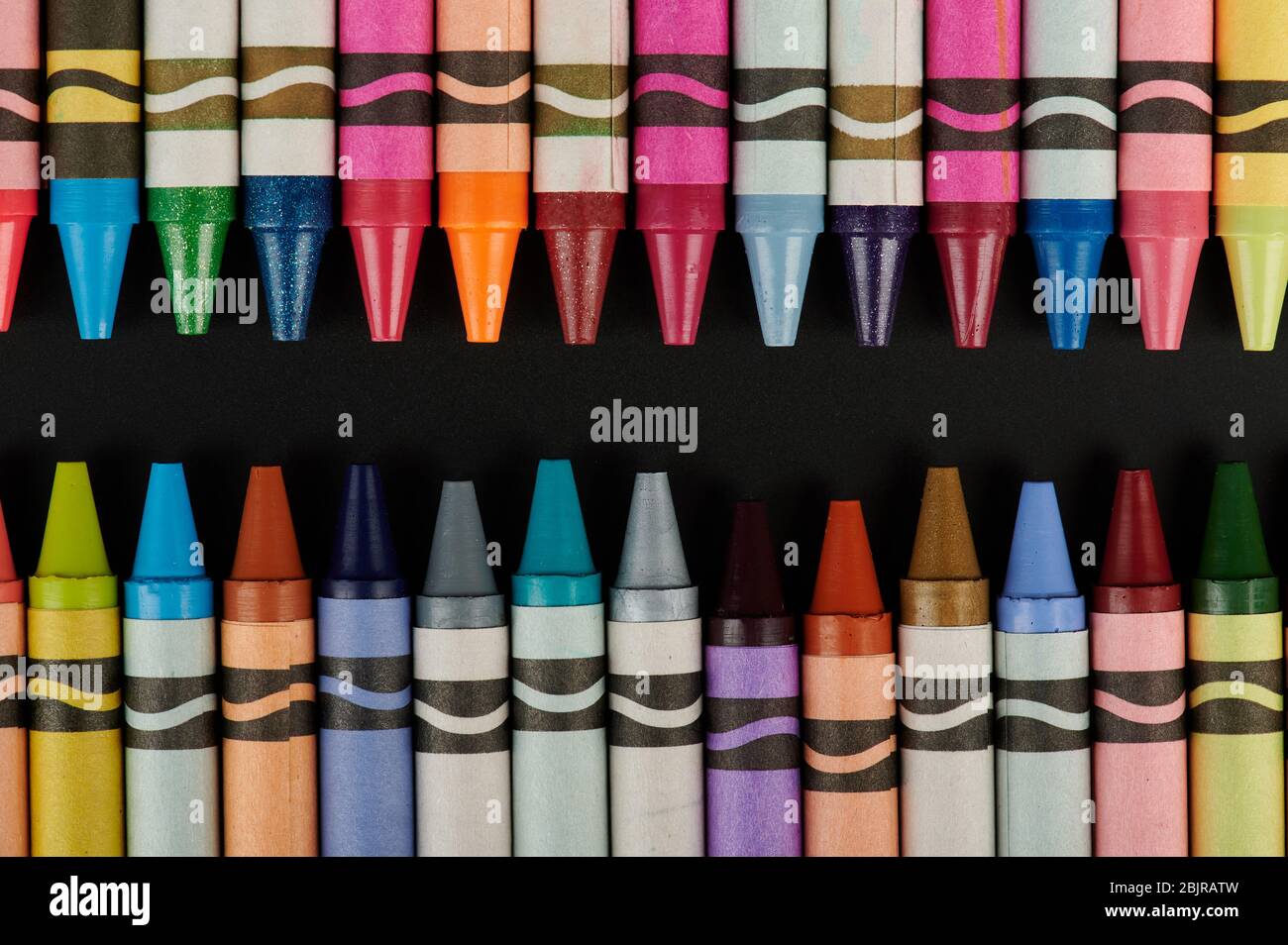 Set of wax colorful crayons on black board background Stock Photo - Alamy