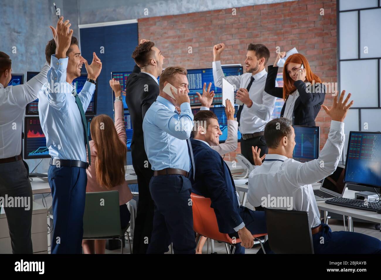 Stock traders working in office Stock Photo - Alamy