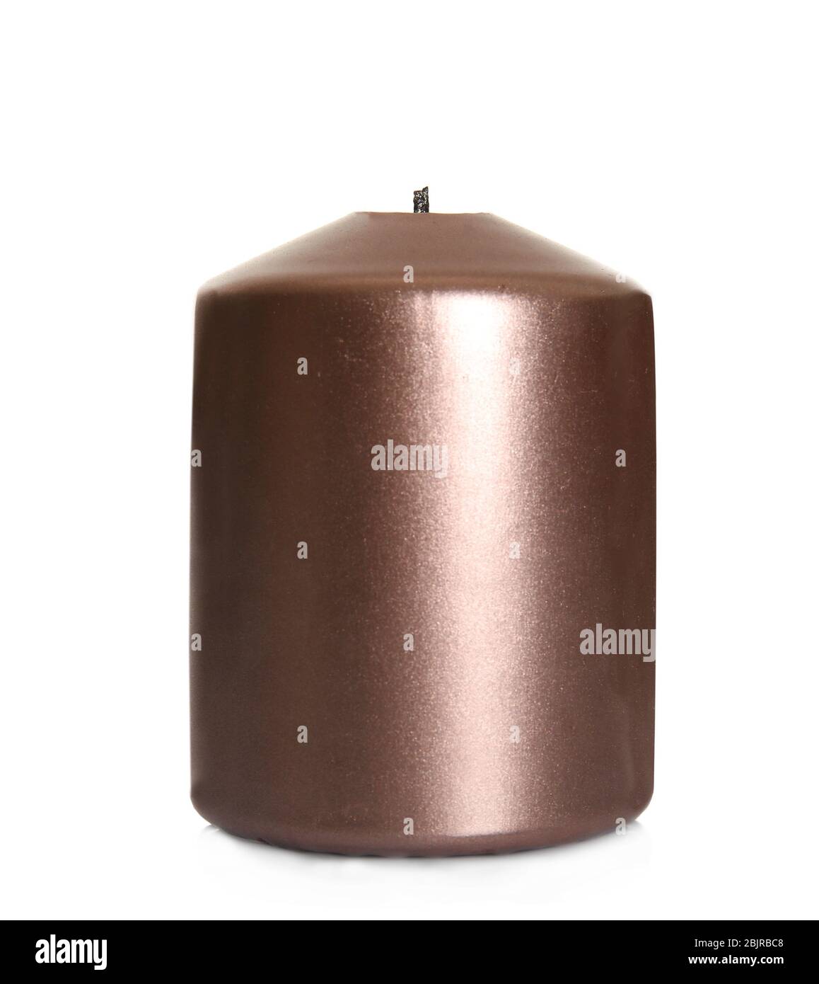 Metallic pillar candle on table against white background Stock Photo ...