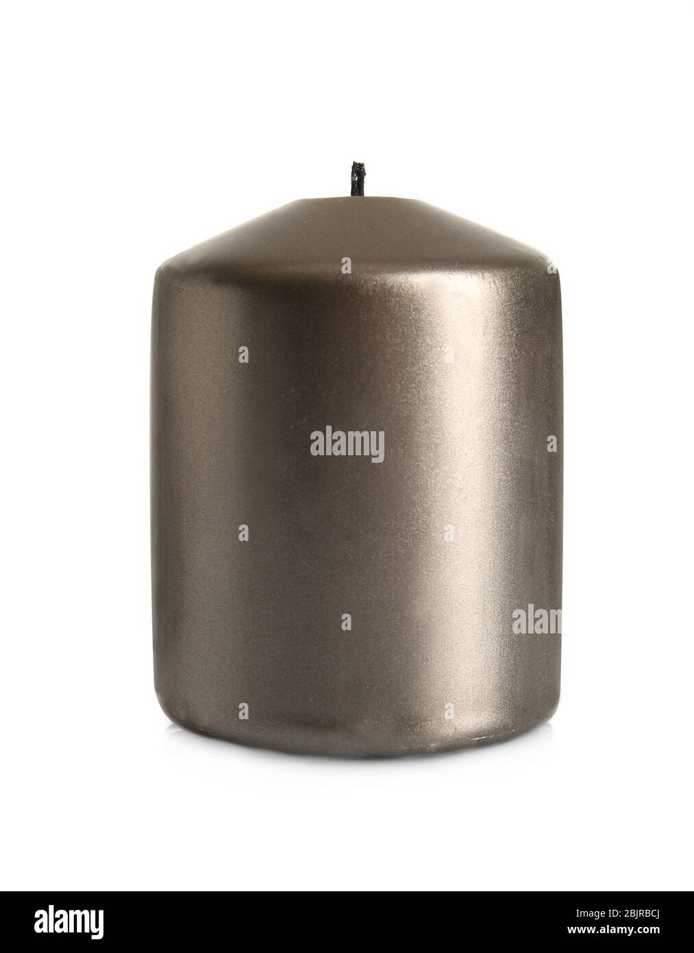 Metallic pillar candle on table against white background Stock Photo ...