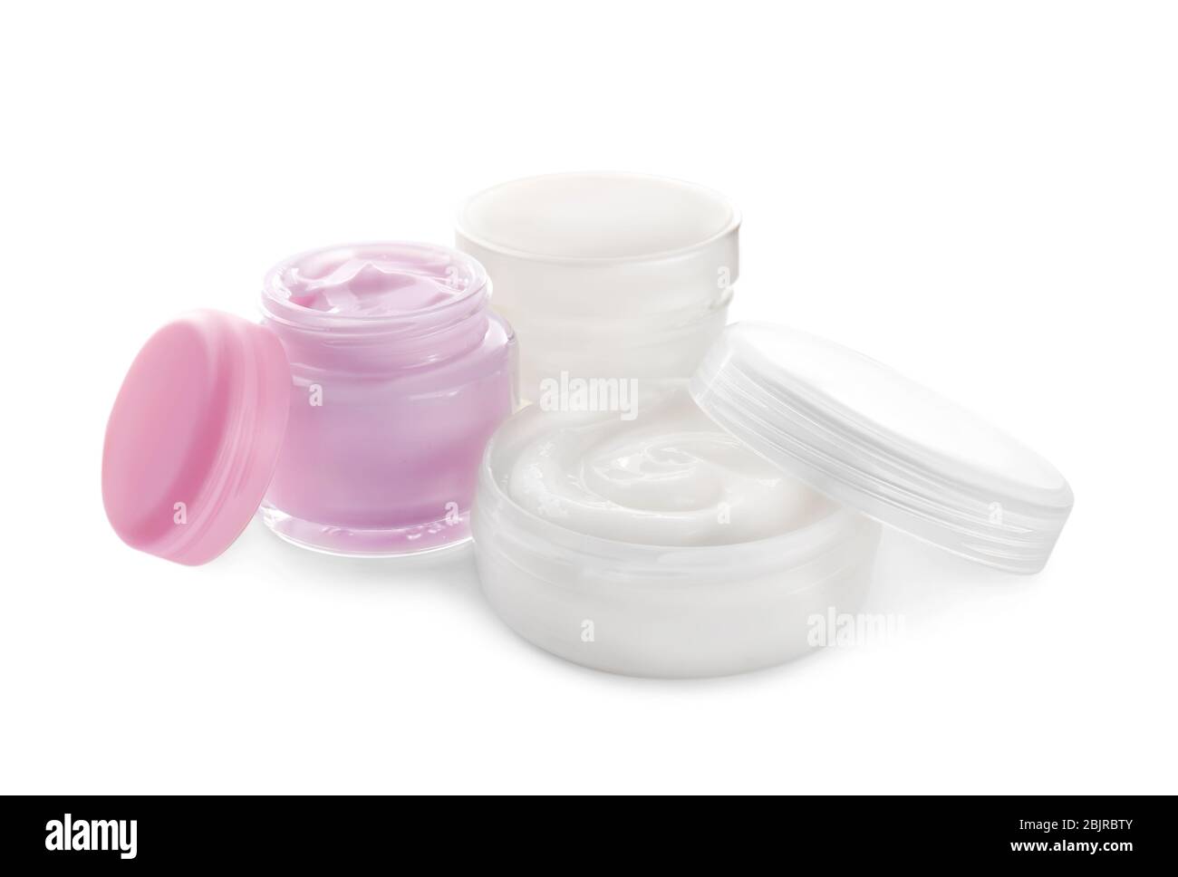 Jars with body cream on white background Stock Photo - Alamy