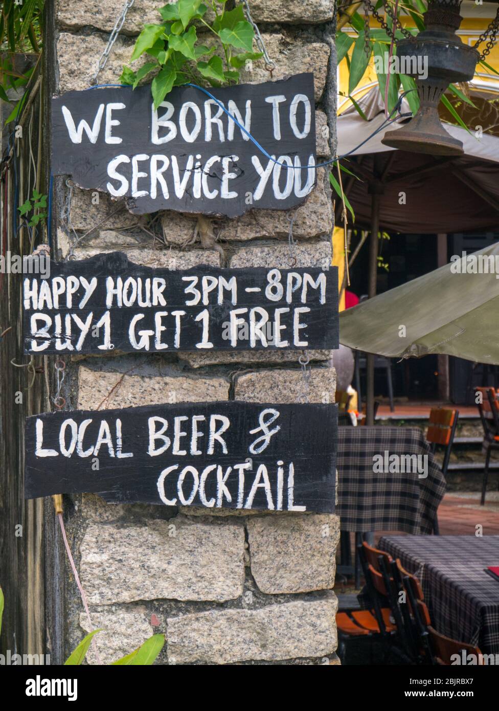 Hoi An is a world heritage site city in Vietnam. A handwritten sign ...