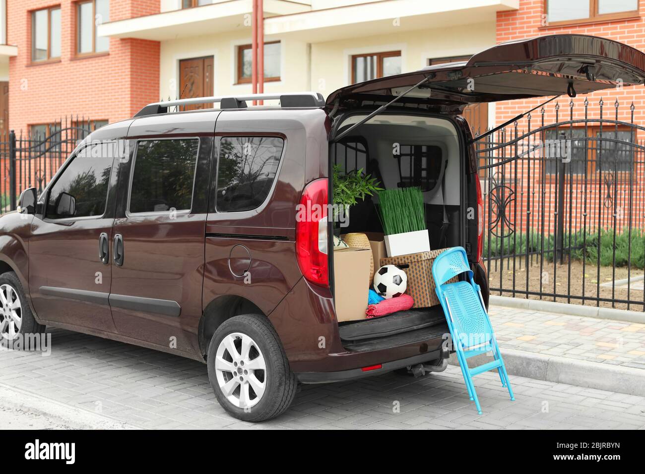 Cardboard boxes in car trunk on moving day Stock Photo - Alamy