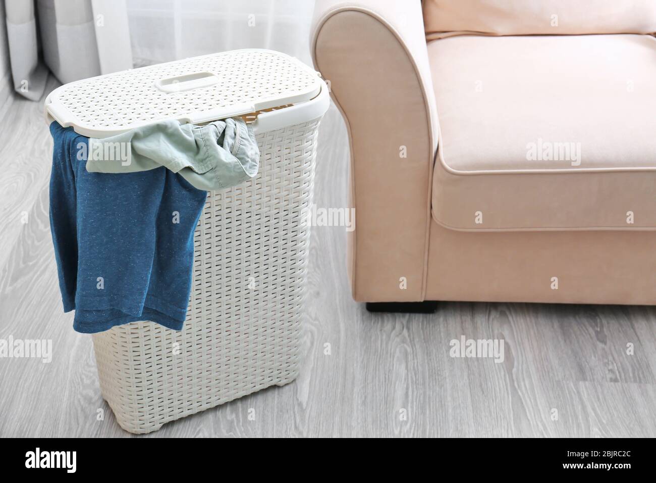 Overflowing laundry basket hi-res stock photography and images - Alamy