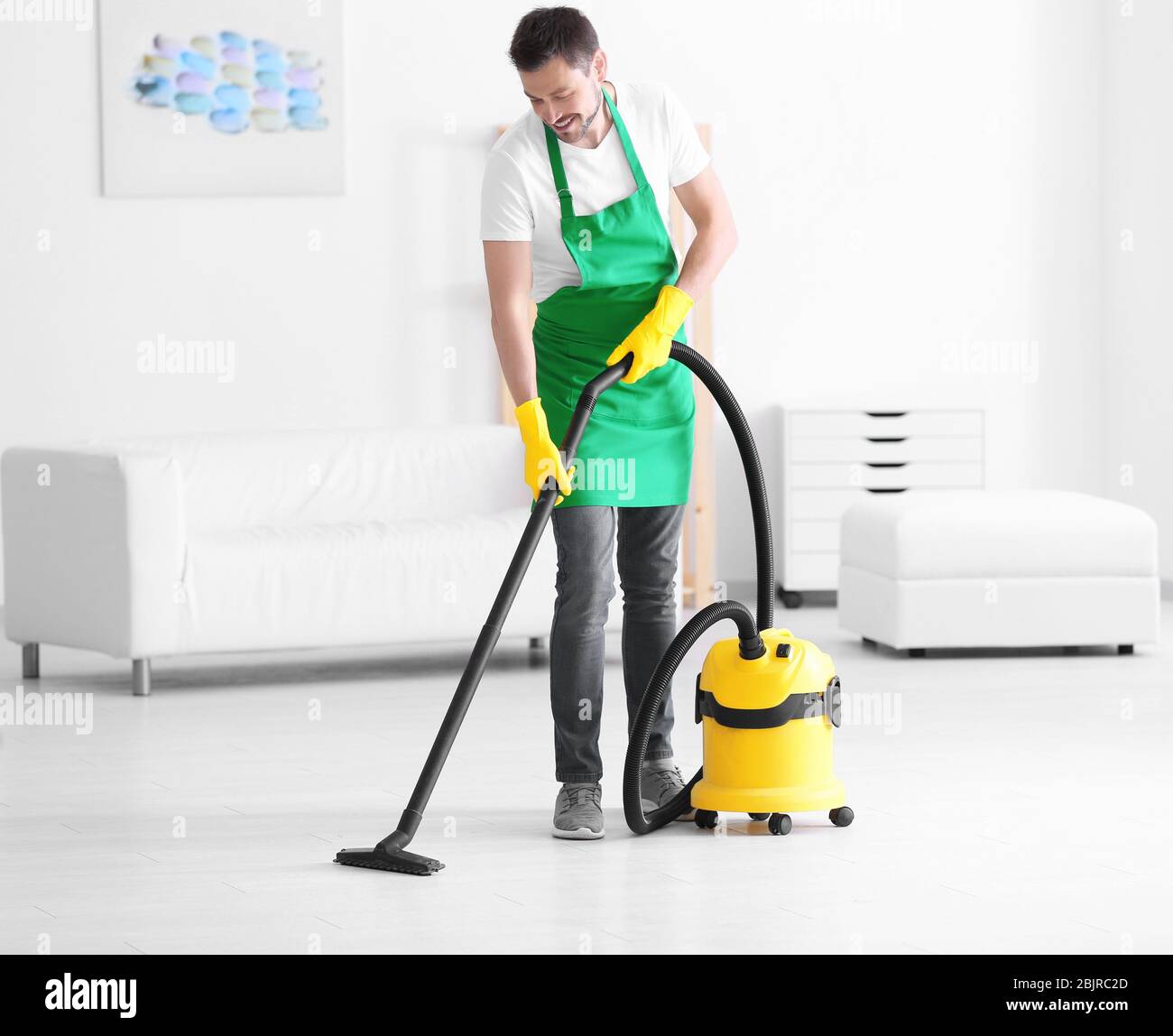 Portrait man standing vacuum cleaner hi-res stock photography and ...