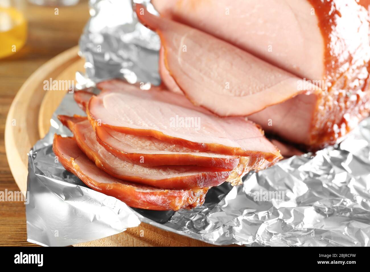 Traditional sliced honey baked ham on board, closeup Stock Photo - Alamy