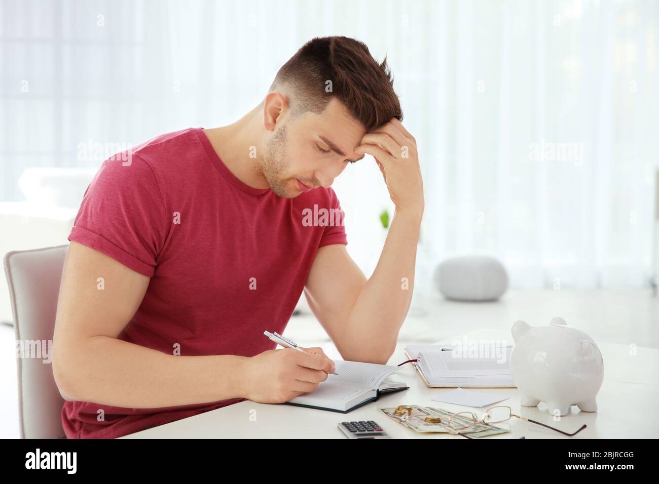 Serious man counting cash money hi-res stock photography and images - Alamy