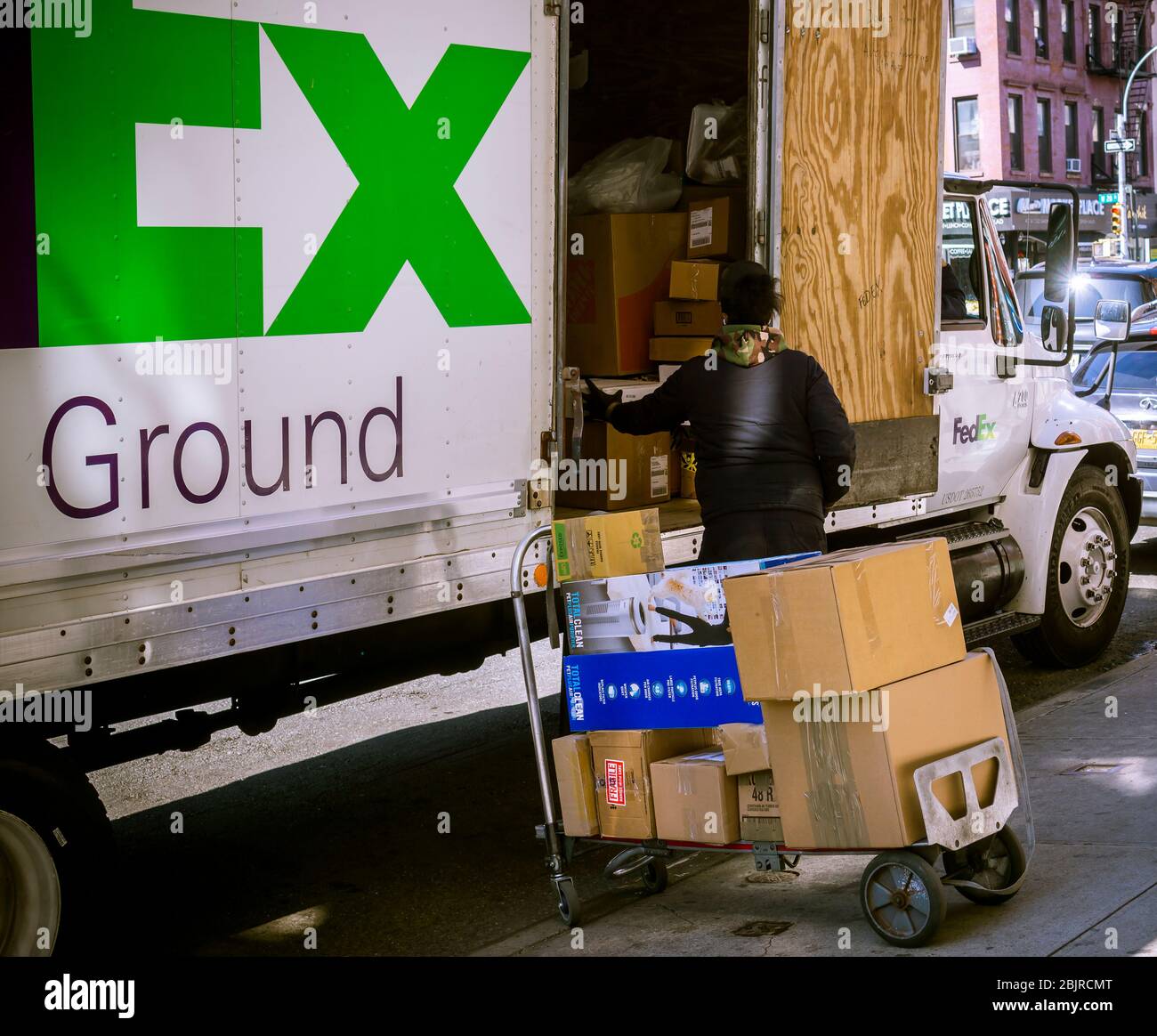 Federal express workers sort packages hi-res stock photography and ...